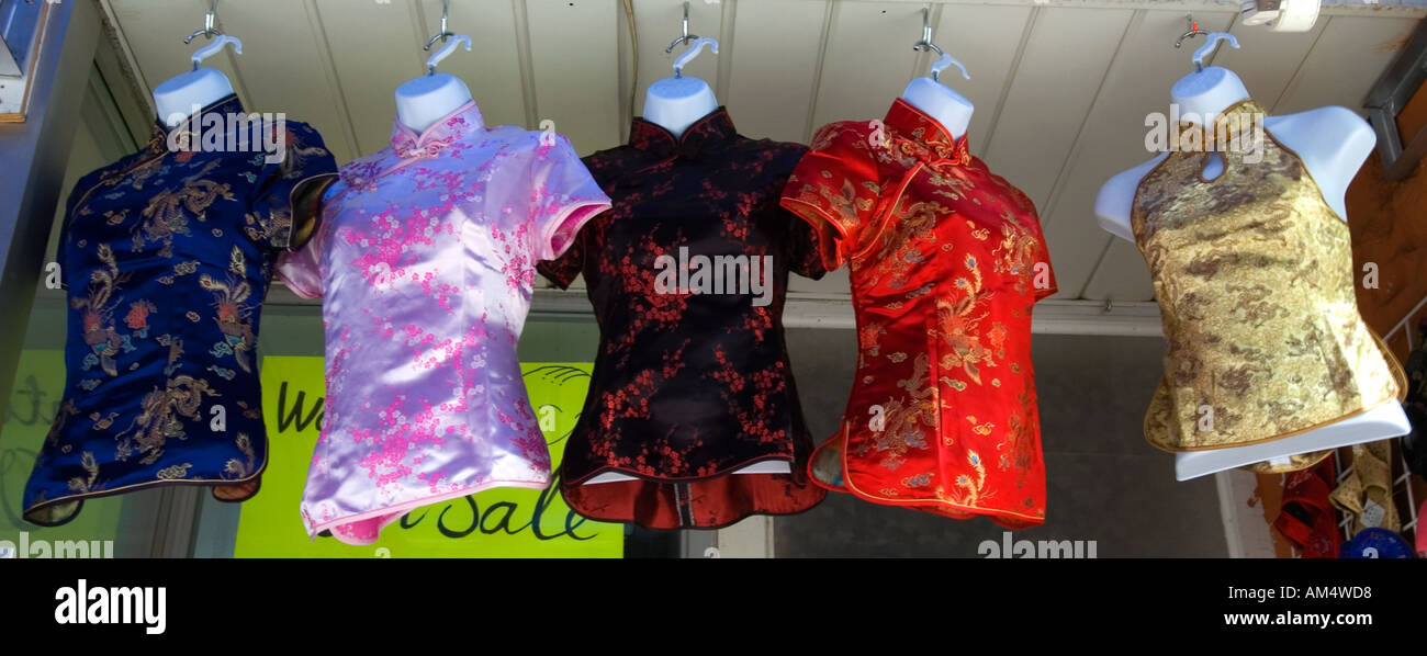 satin tops on display at small clothing store Stock Photo - Alamy
