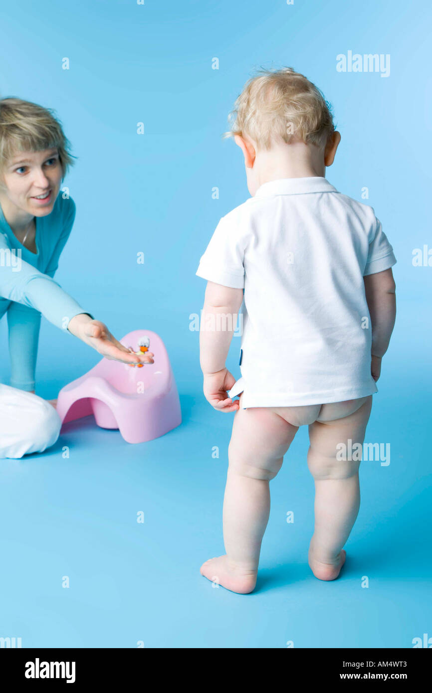 mother making toilet training to her son Stock Photo - Alamy