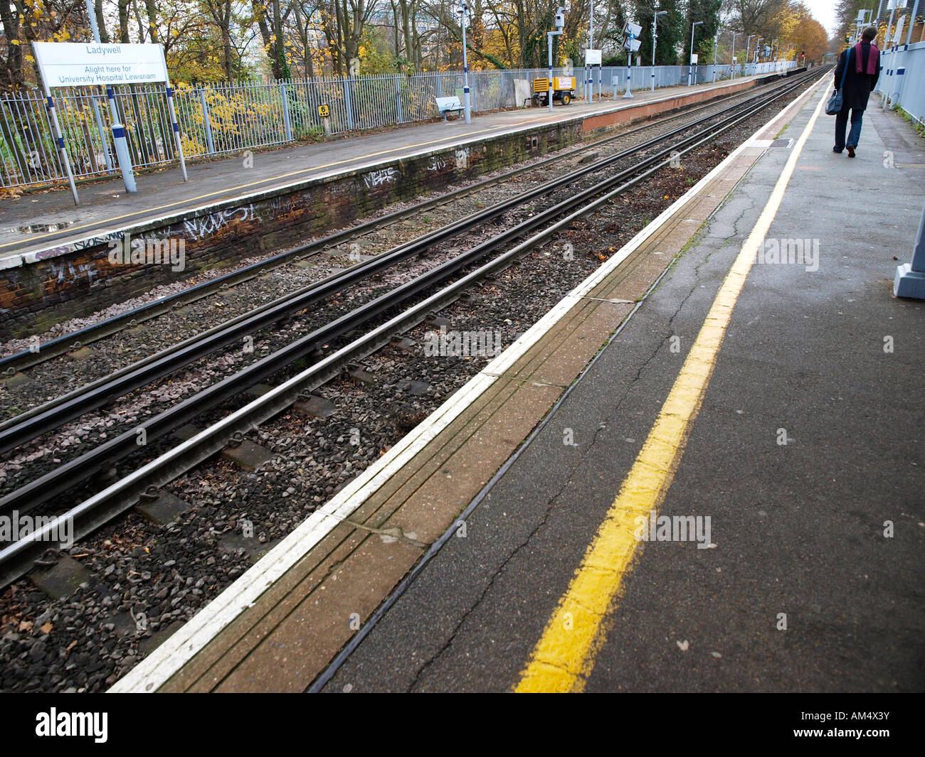 Lone commuter waiting for a train at Ladywell station London Stock ...