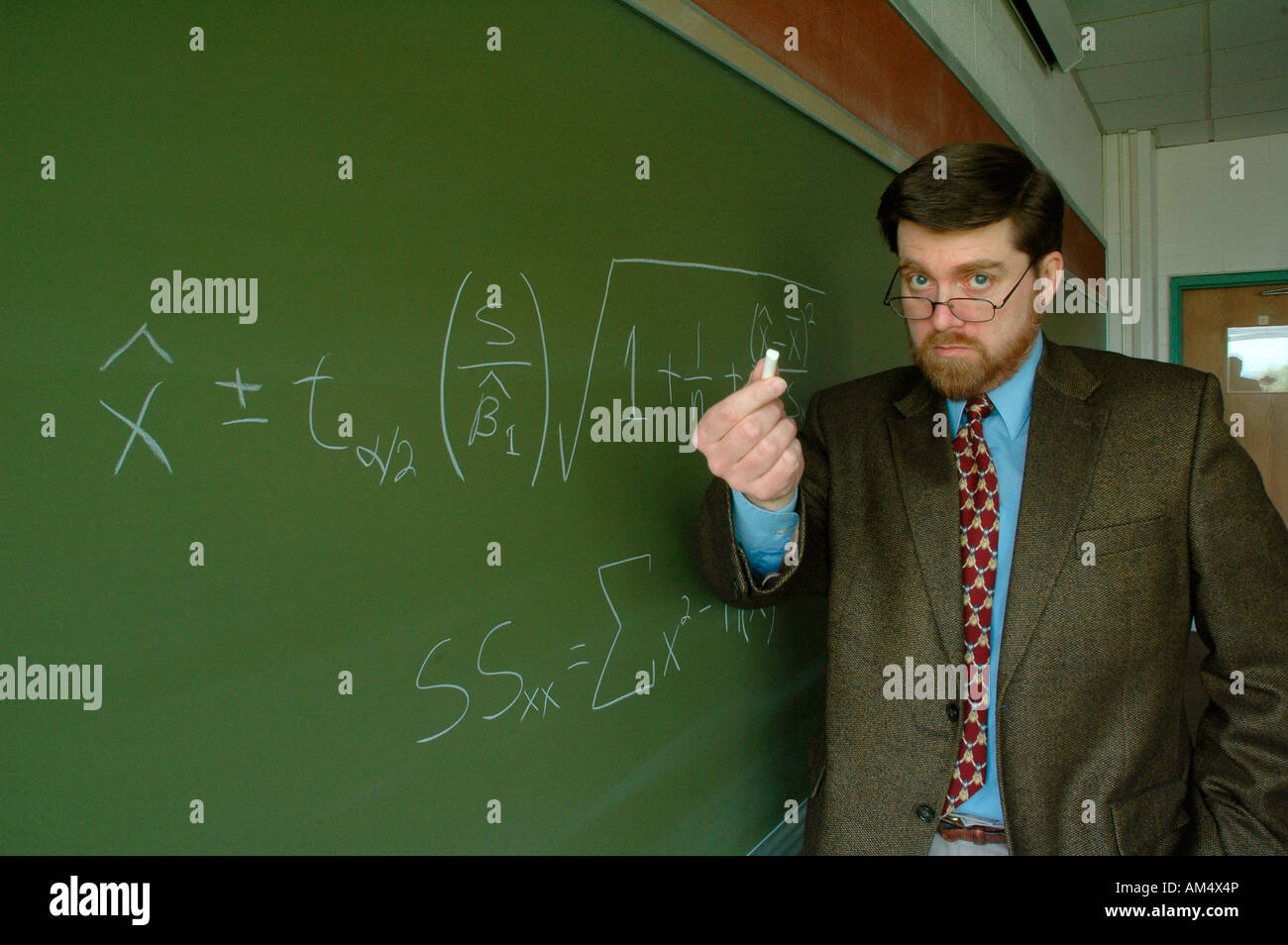 College professor or teacher in front of a a statistical regression ...