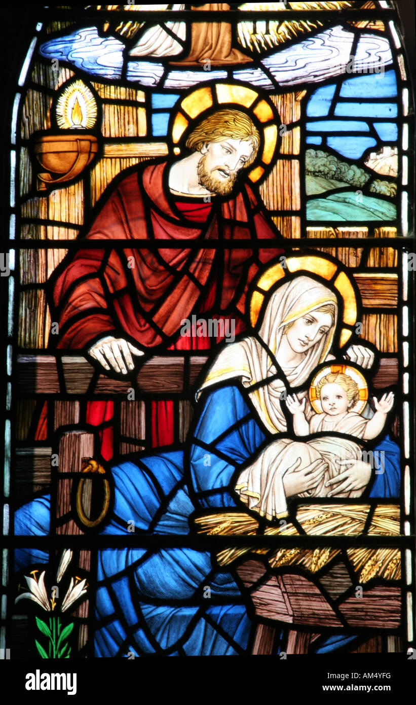 A stained glass window of Mary Joseph and baby Jesus Stock Photo - Alamy