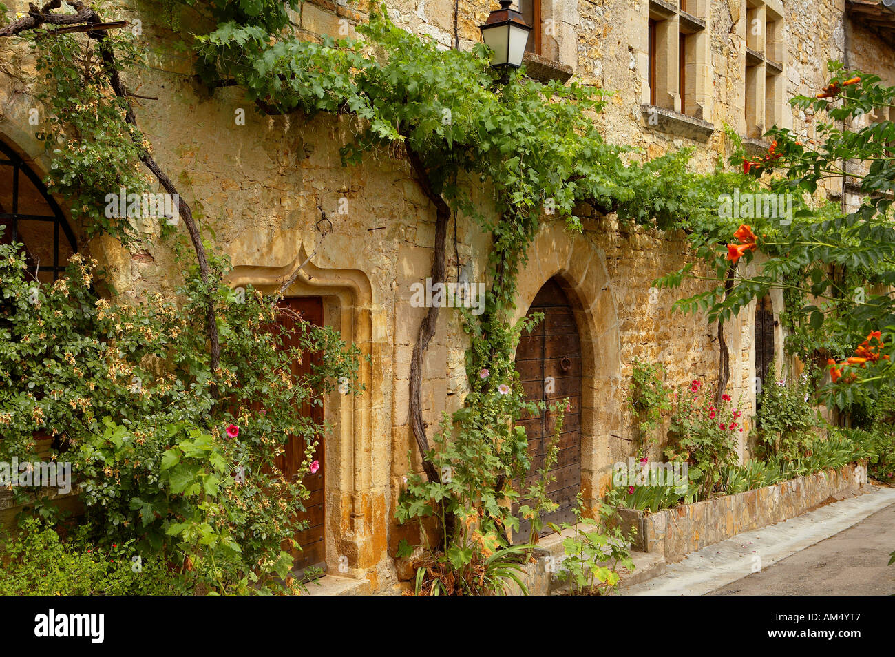 doorway and facade of an old rustic house in the medieval village of ...