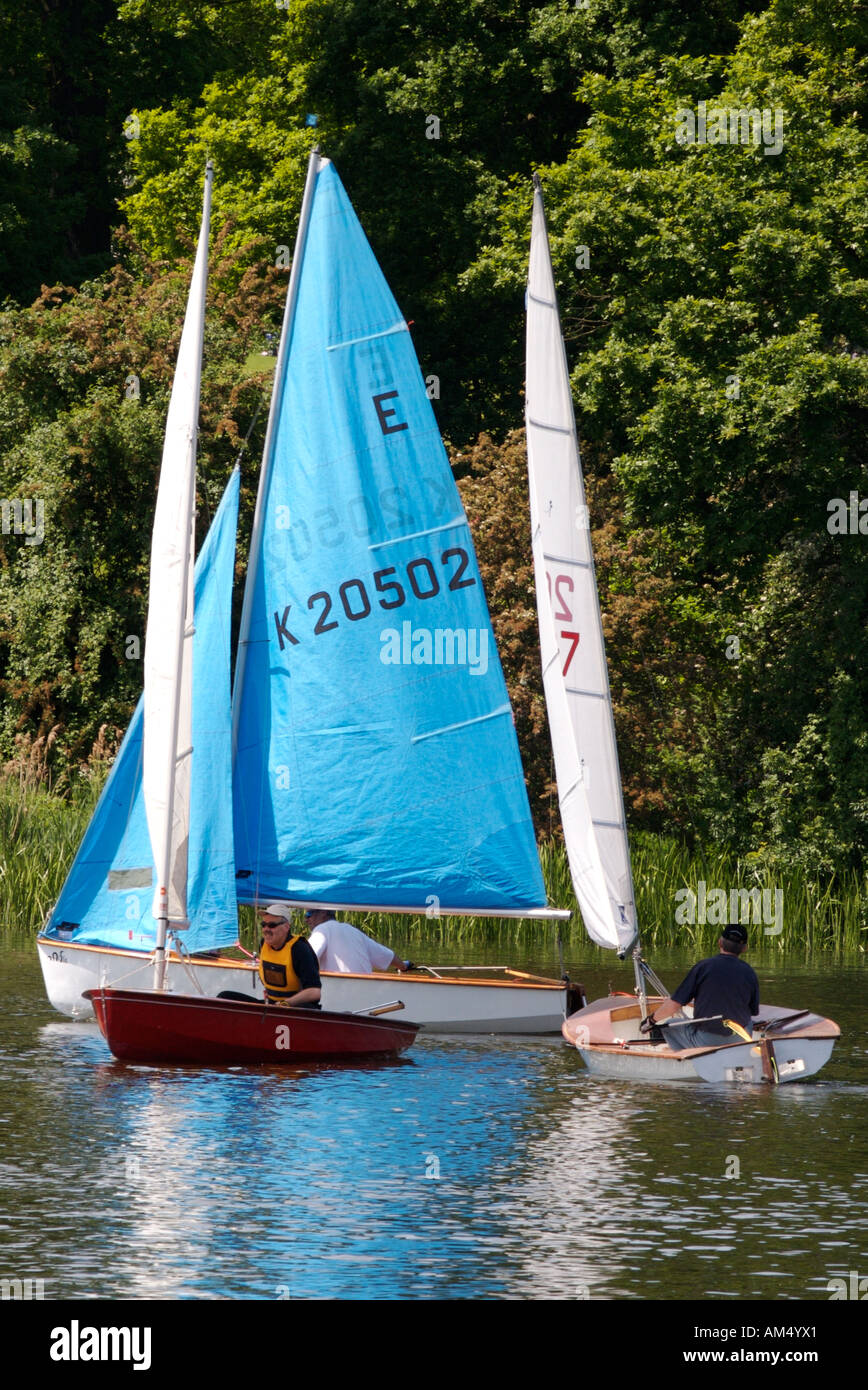 Three sailing boats on Mote Park lake on a sunny day in Maidstone, Kent ...