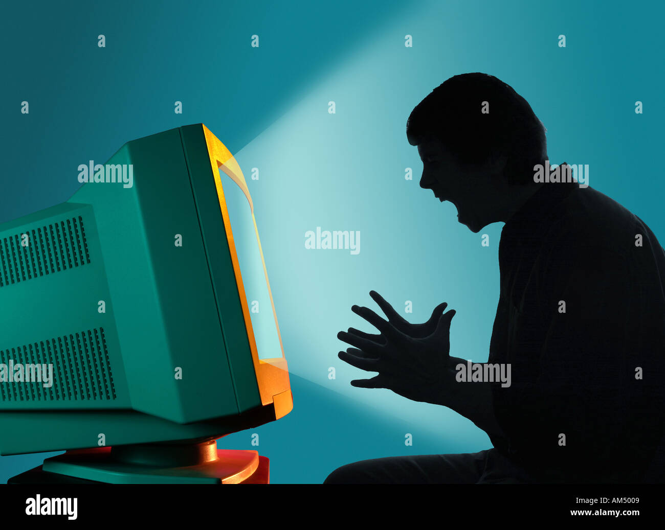 man angry at his computer yells at the screen Stock Photo - Alamy