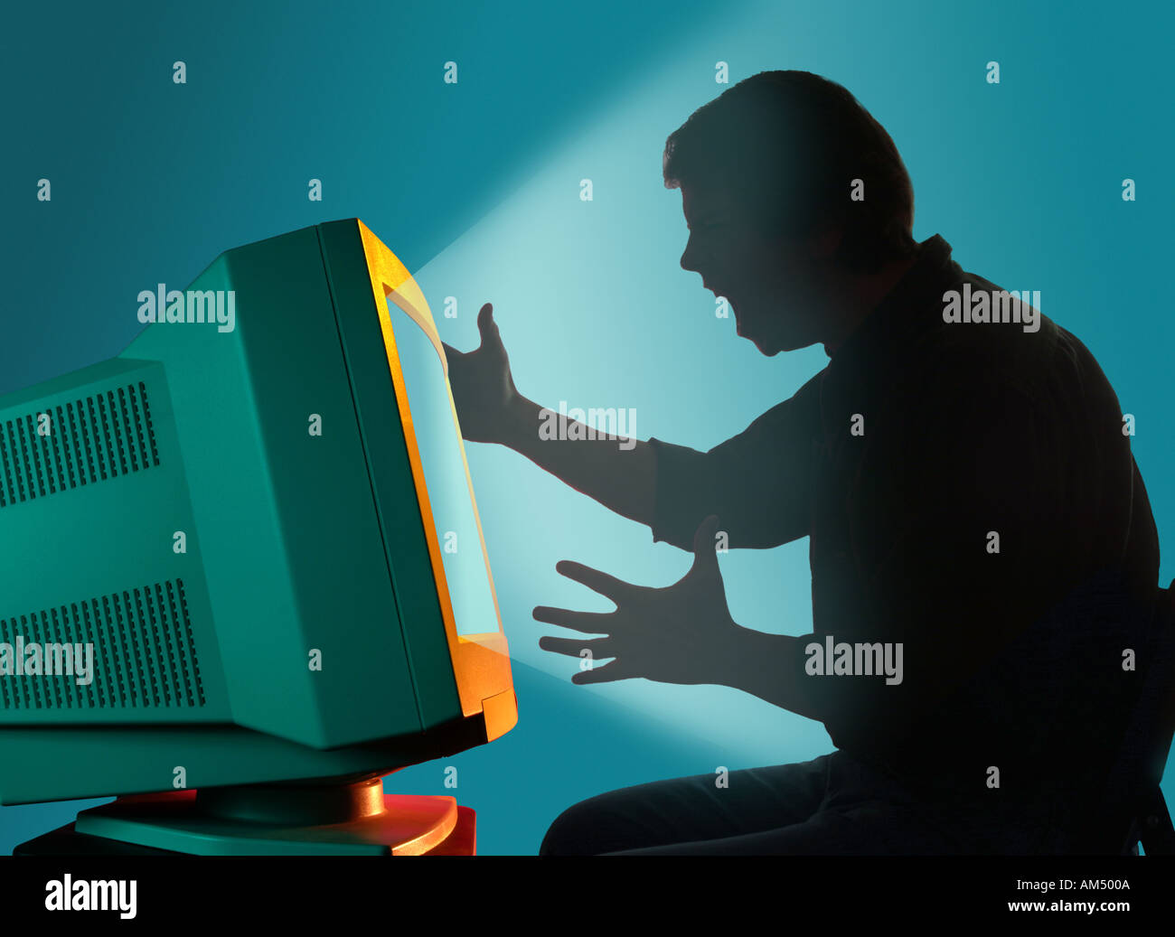 man angry at his computer yells at the screen Stock Photo - Alamy