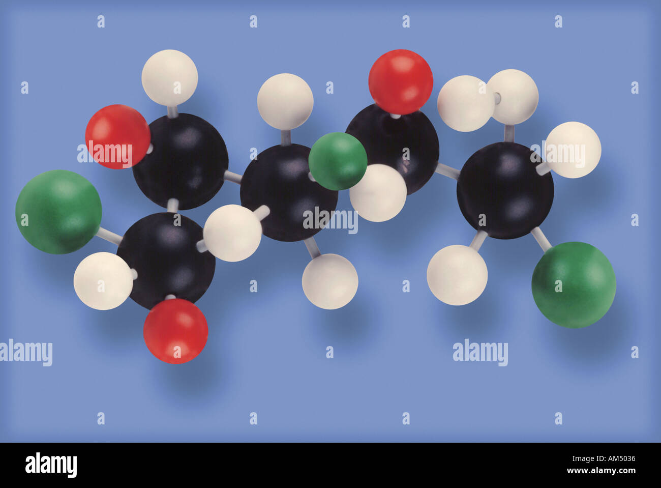 model of a molecule with black red white and green atoms Stock Photo ...