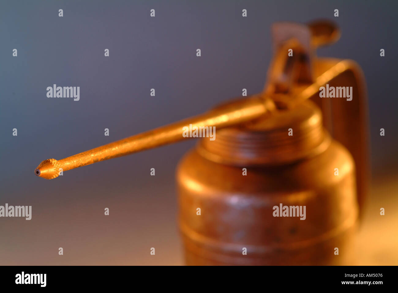 old fashioned metal oil can in golden light Stock Photo - Alamy