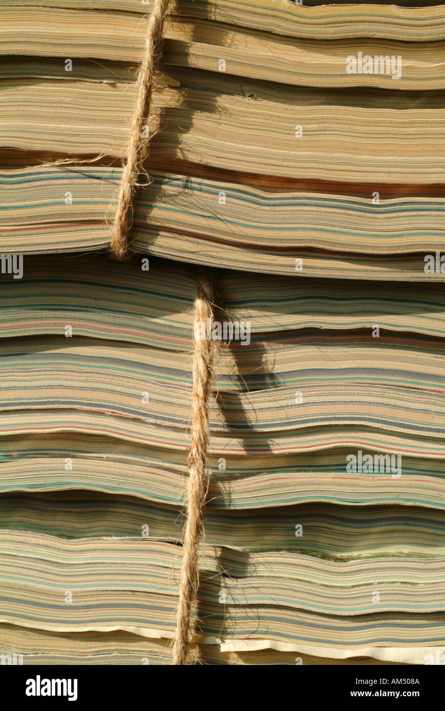 stack of magazines bound with string and ready to be recycled Stock ...