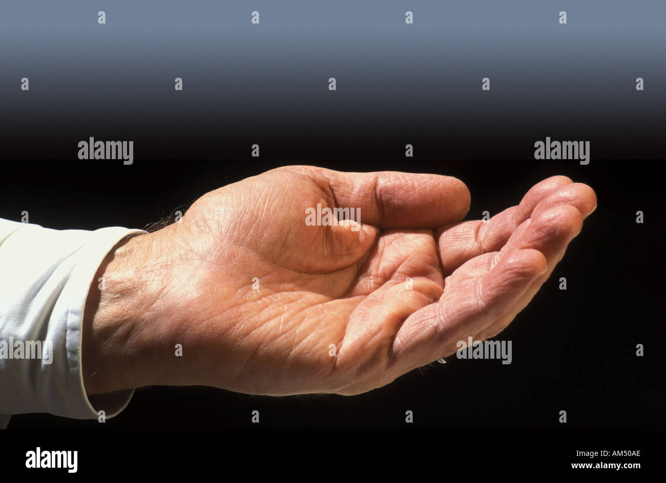 hand out as if begging or waiting for change Stock Photo - Alamy
