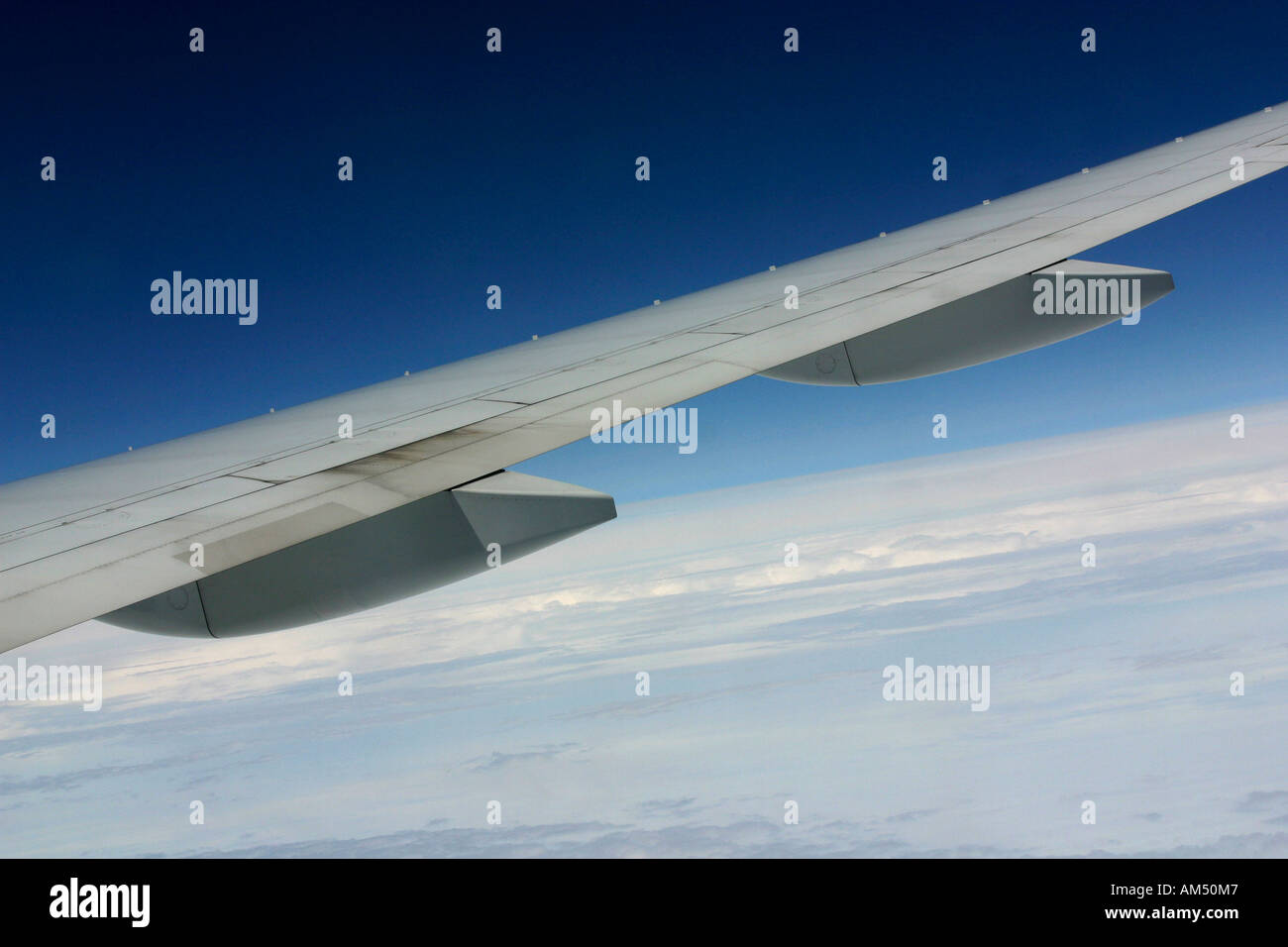 Clouds beneath an areoplane wing aircraft hi-res stock photography and ...