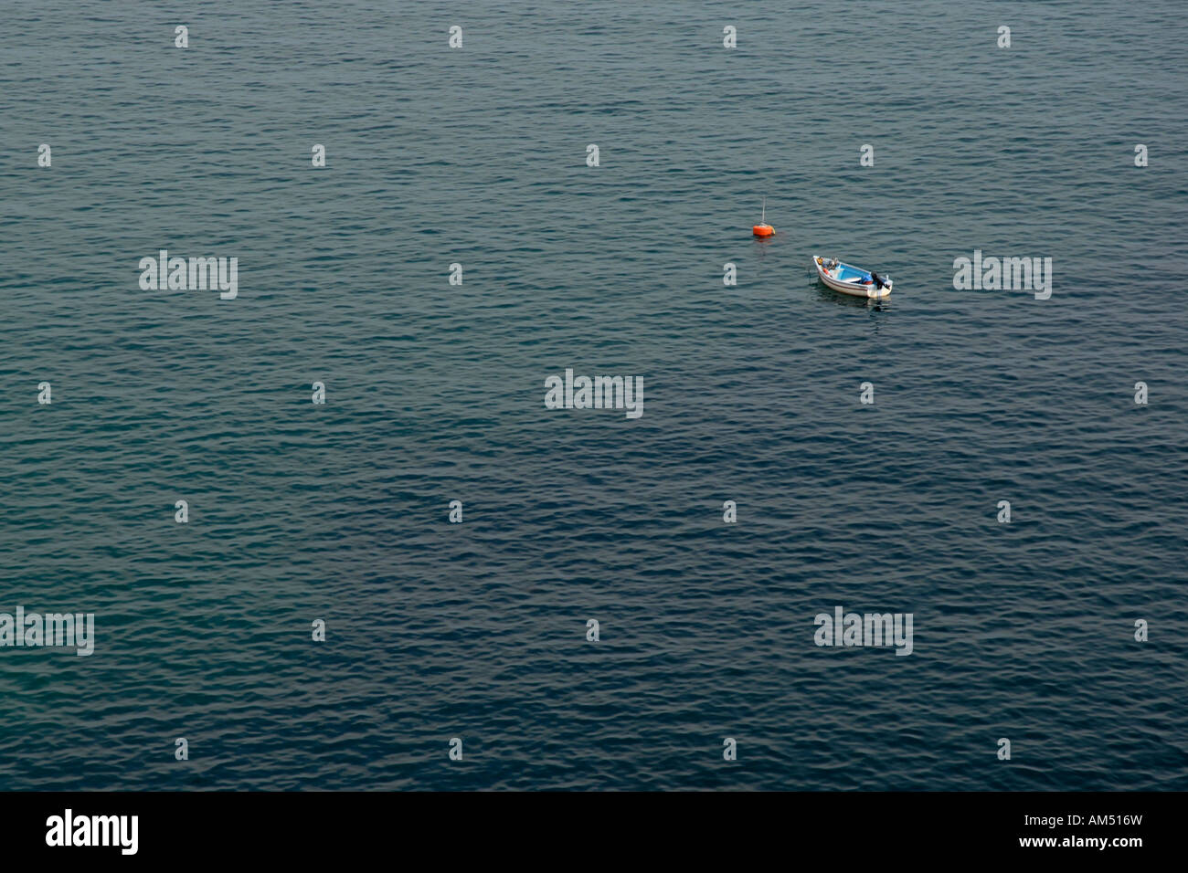 Fishing boat floating on Sea Stock Photo - Alamy