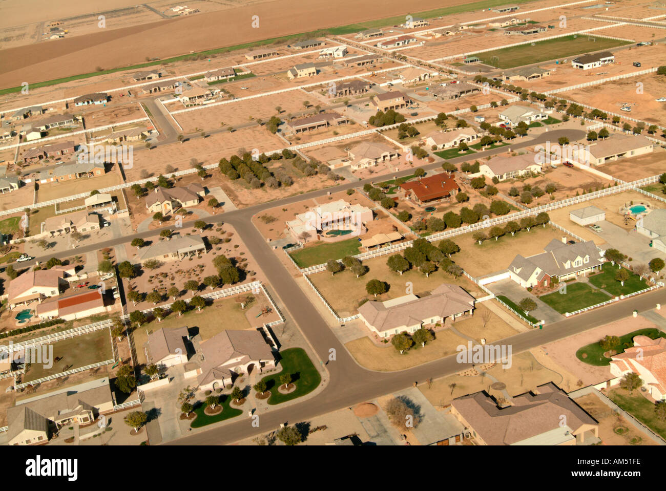 suburban sprawl over running farmland in the American southwest Stock ...