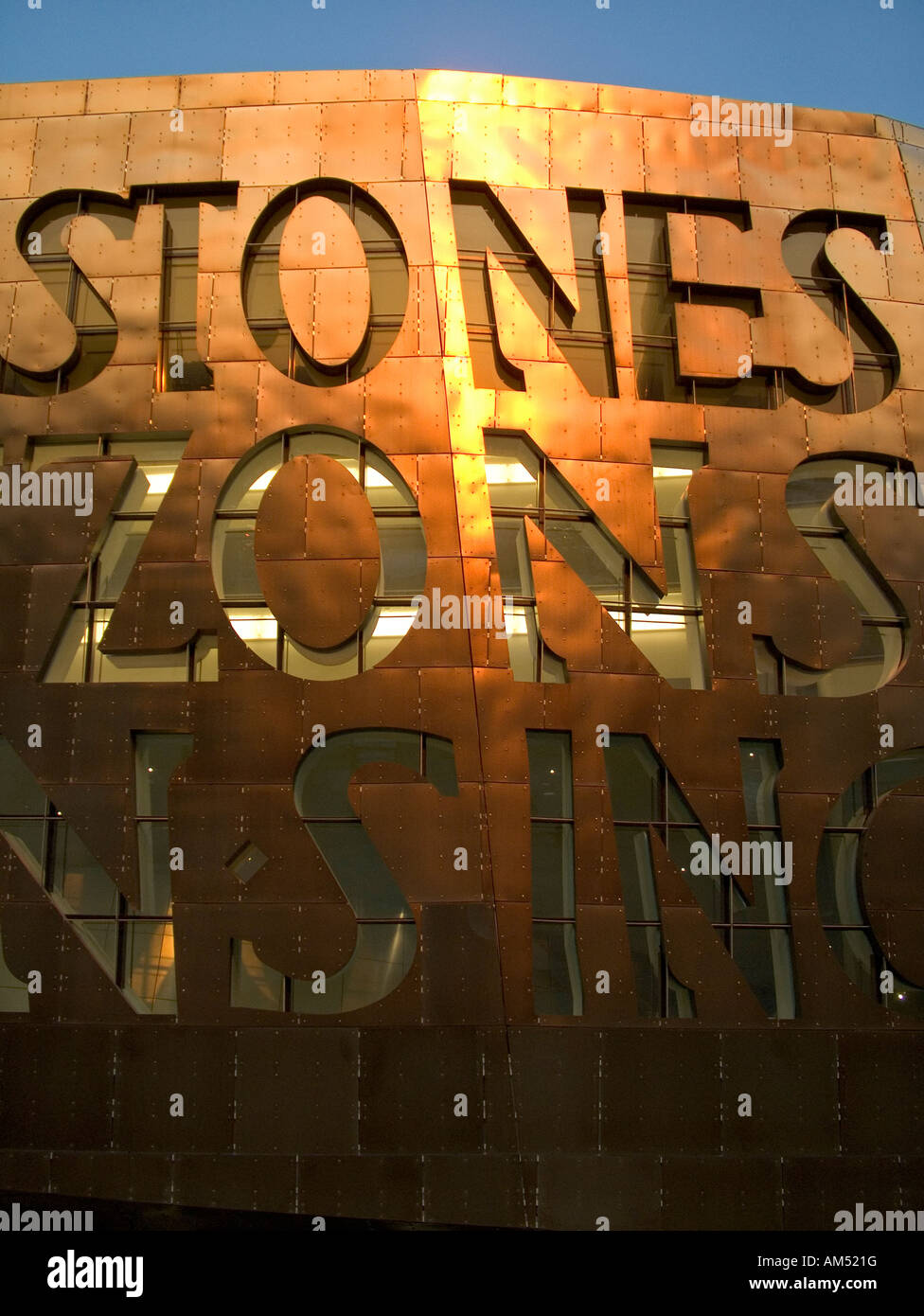 Sunlight reflected on copper surface of Millennium Centre Cardiff Bay ...