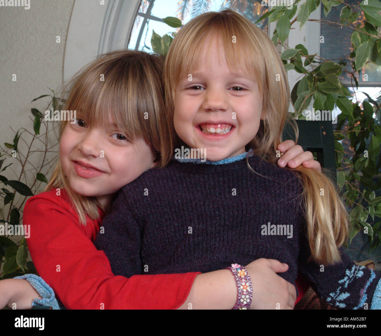 two girls who are best friends playing in their room Stock Photo - Alamy