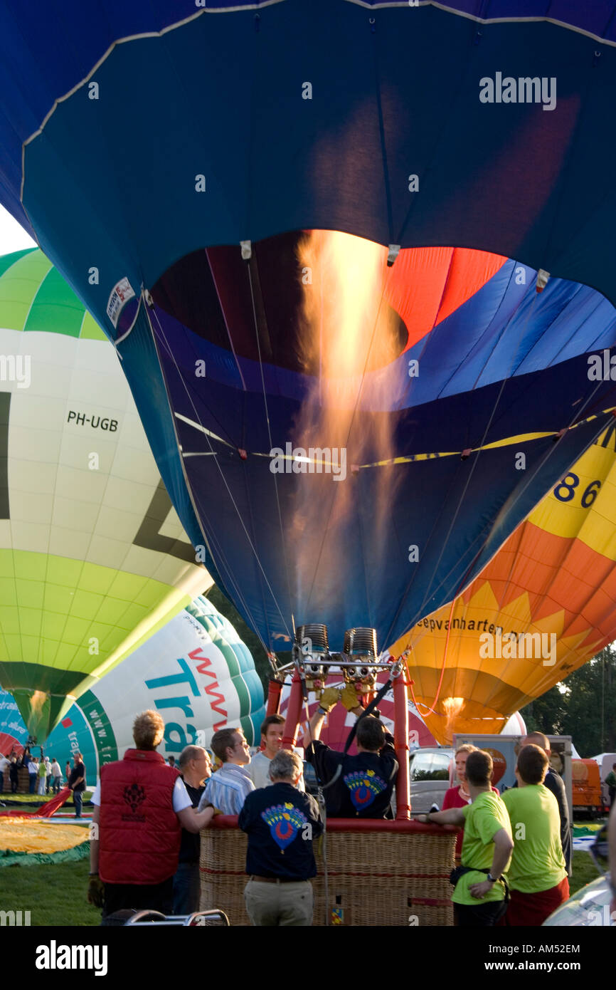 Inflatinghot-air balloon with flame thrower Barneveld, Holland Stock ...