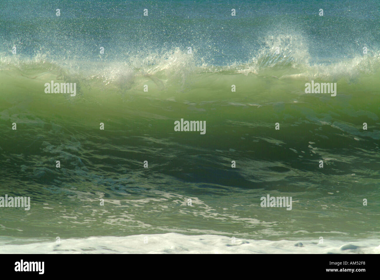 Powerful ocean waves rolling up to a beach Stock Photo - Alamy