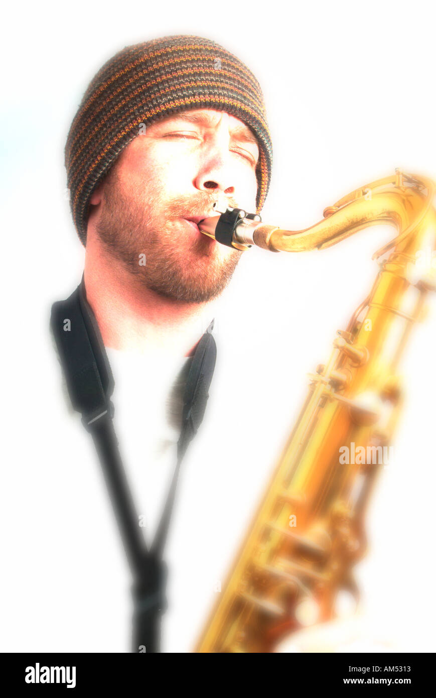 young musician playing a saxophone Stock Photo - Alamy