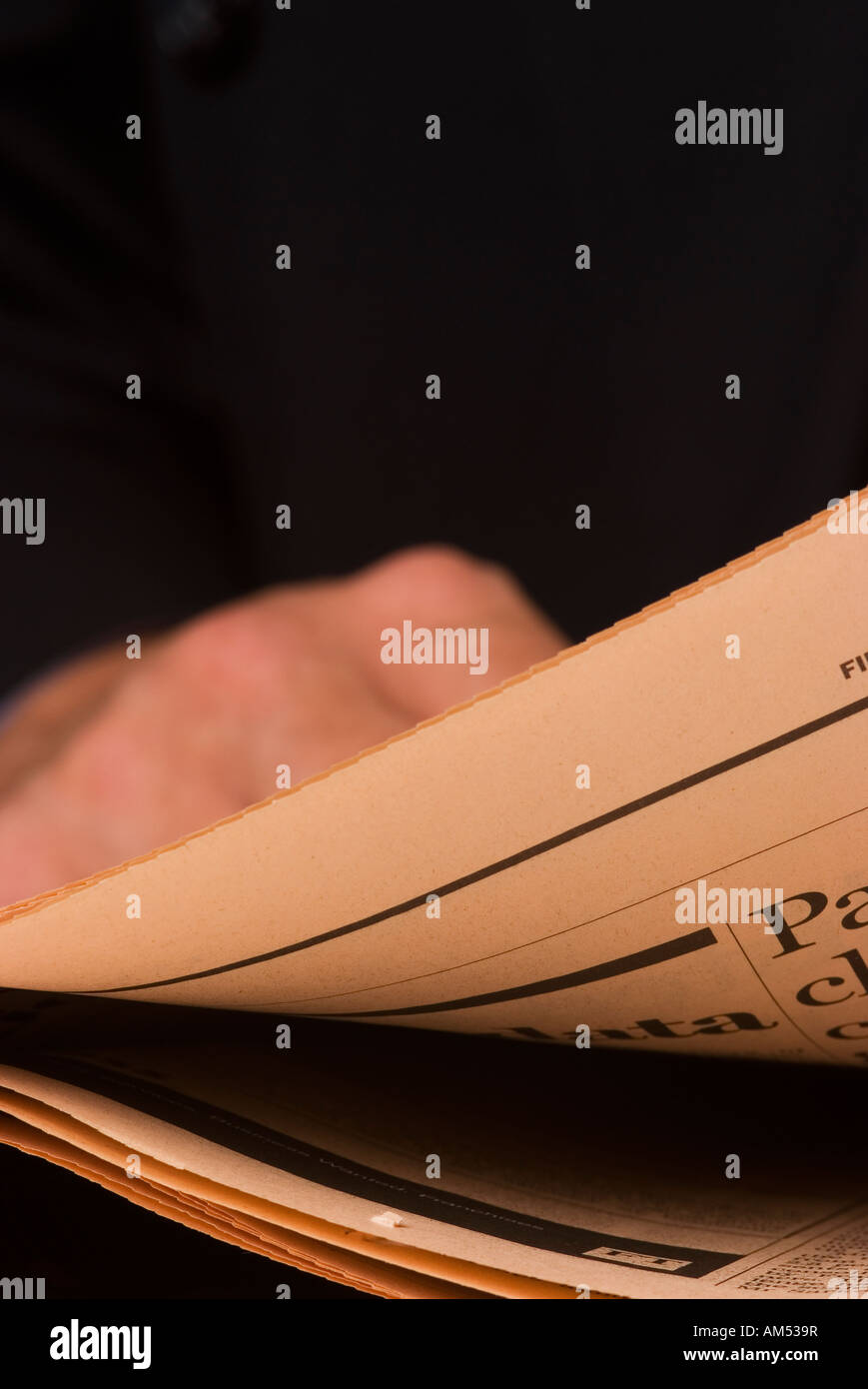 Close shot of business man reading paper Stock Photo - Alamy