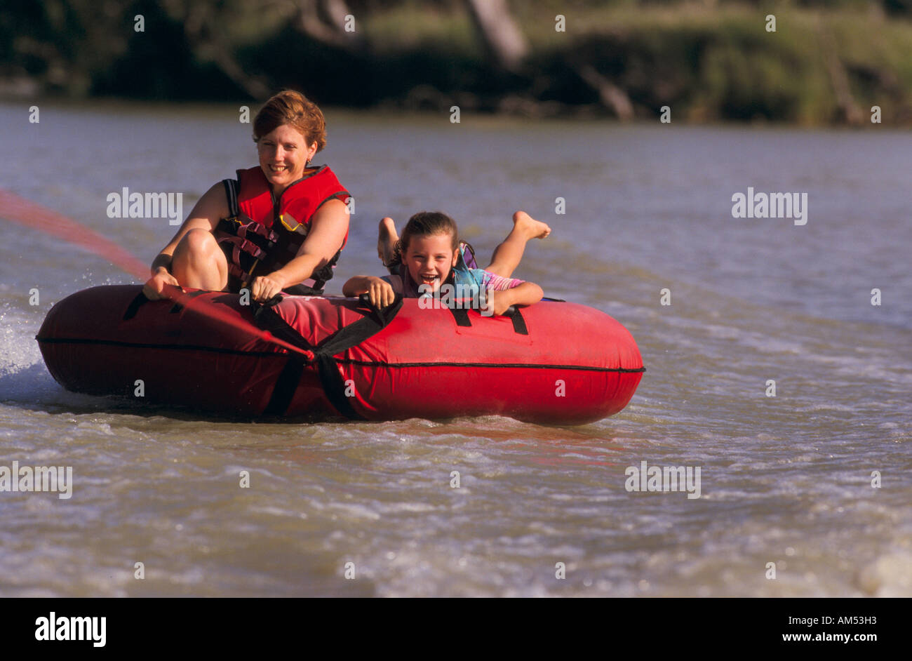 Mother and daughter tubing on a river near Blanchetown Murray River ...