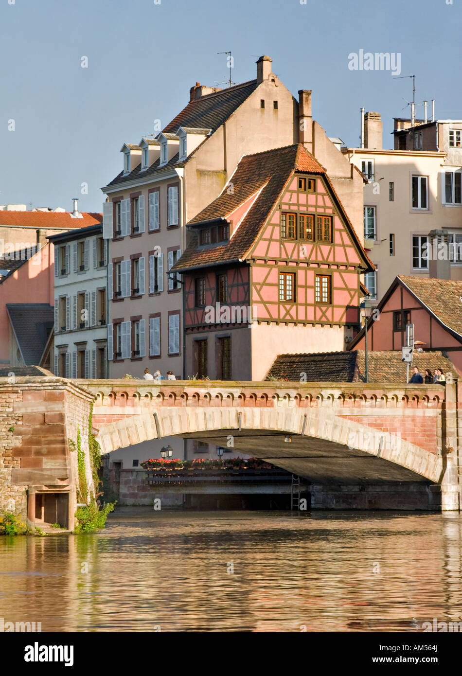 Medieval buildings behind one of the many bridges in Strasbourg, France ...