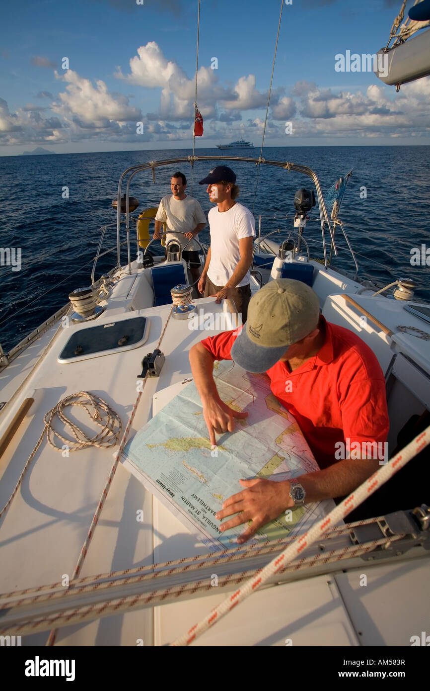 Man reading a map while sailing in Antigua West Indies Caribean Stock ...