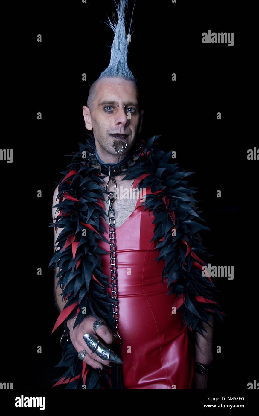 androgynous punk in red rubber Stock Photo - Alamy