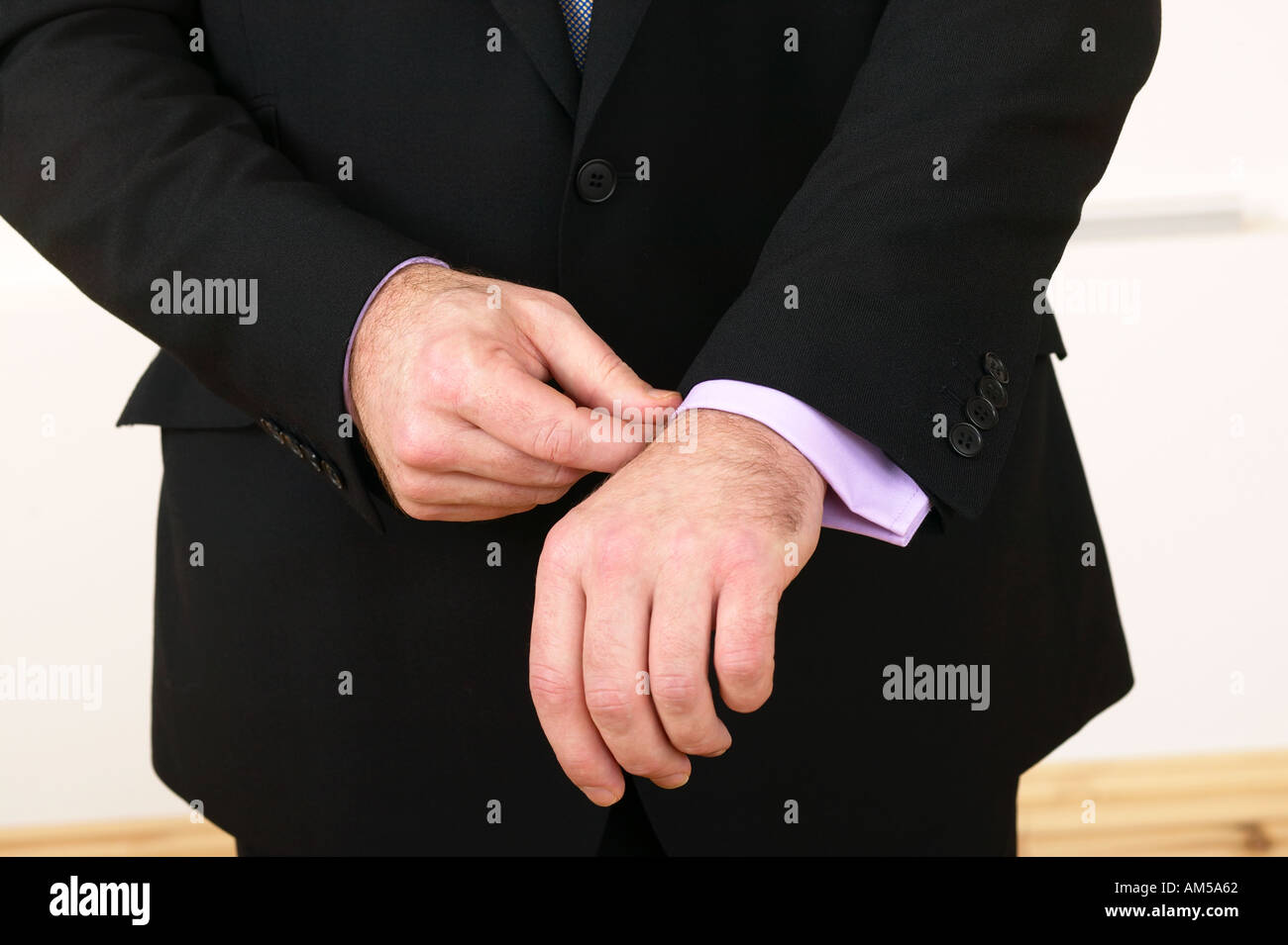 Elegant man adjusting sleeves suit hi-res stock photography and images ...