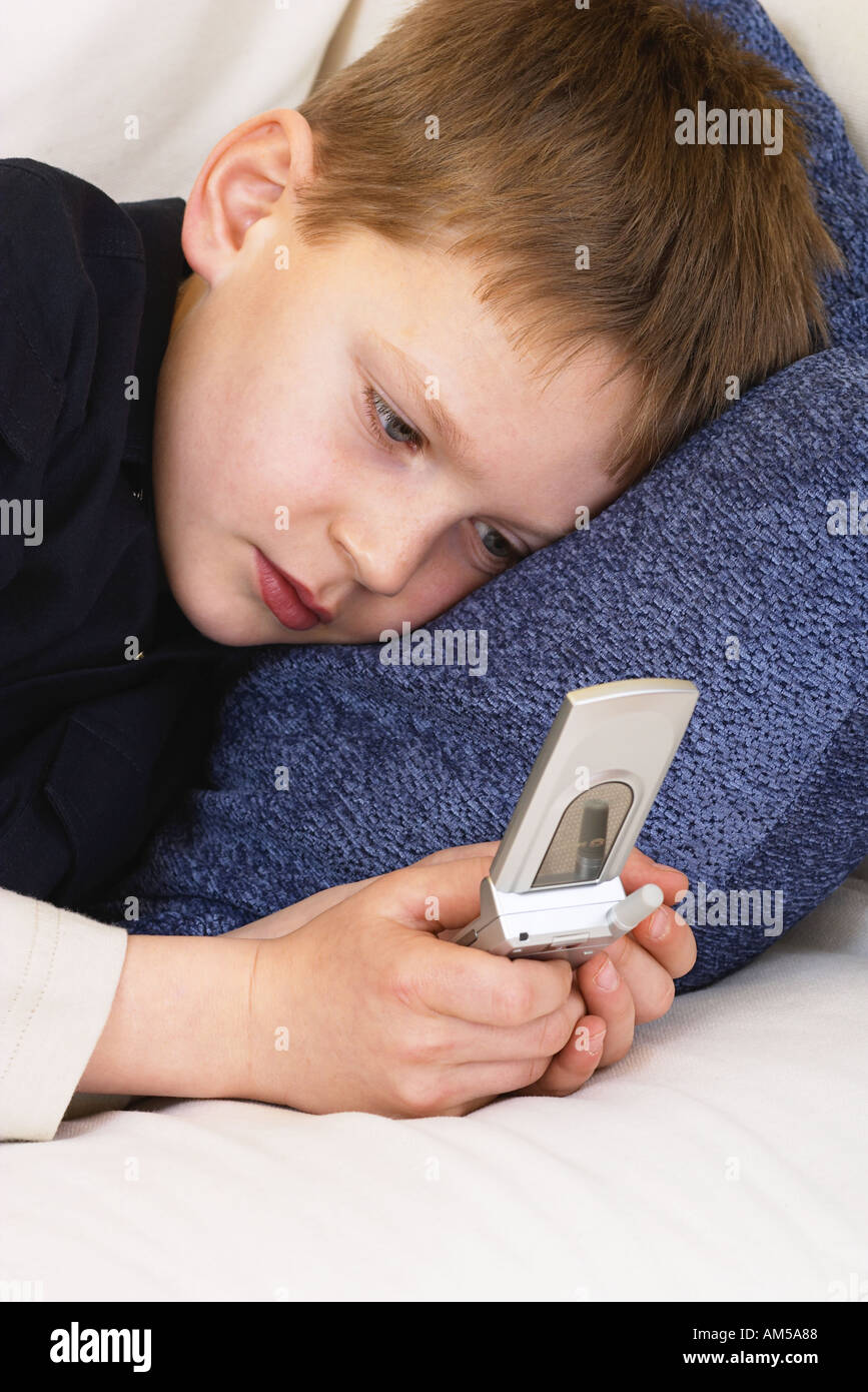 Boy phone sofa preteen hi-res stock photography and images - Alamy