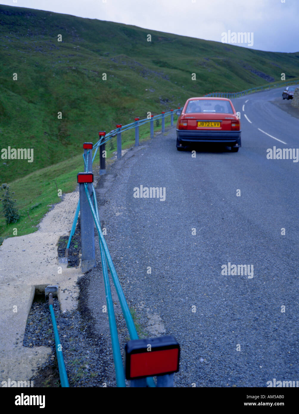 Steel cable type crash barrier showing cable anchorages; Buttertubs ...