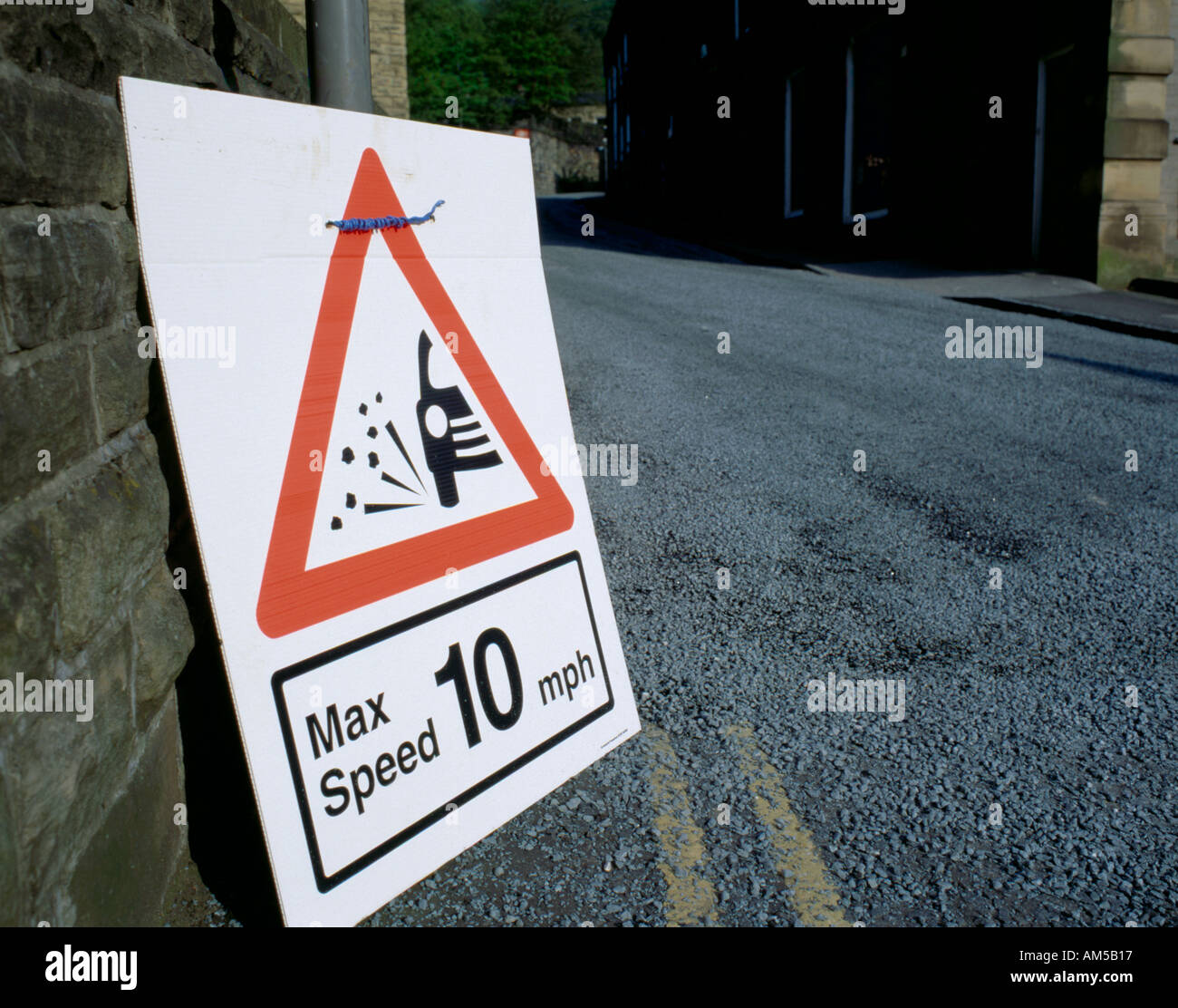 Newly gritted road and speed limit warning sign, England, UK Stock ...