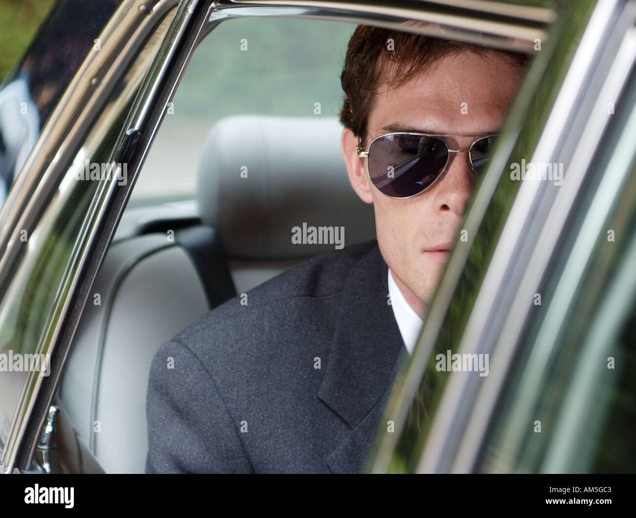 Business man through car window Stock Photo - Alamy