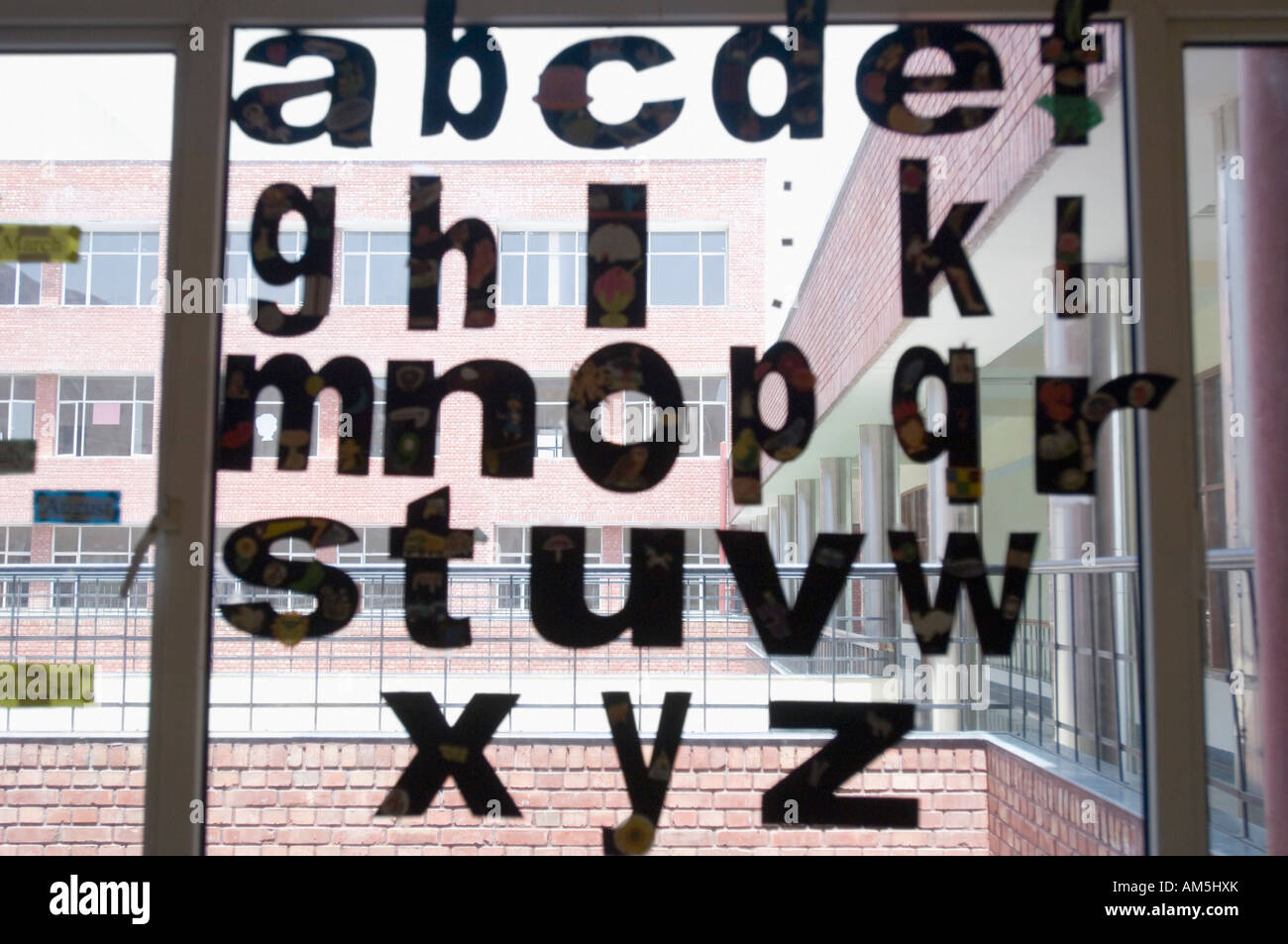 Close-up of alphabets written on a window pane Stock Photo - Alamy