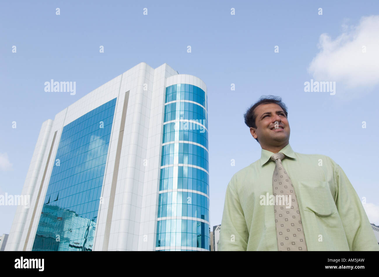 Low angle view of a businessman standing in front of a building Stock ...
