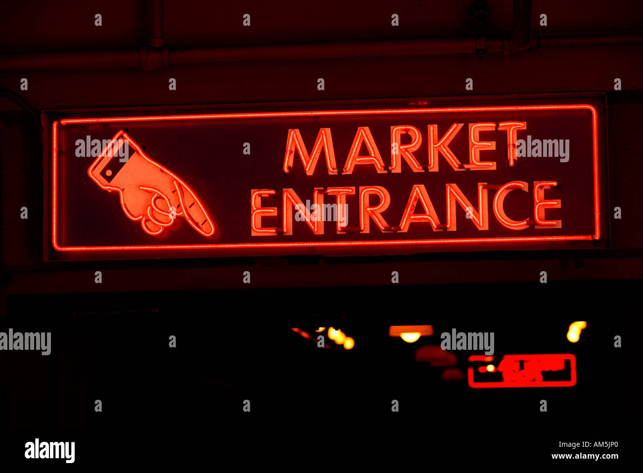 Neon sign Market Entrance with a hand pointing to the right and ...