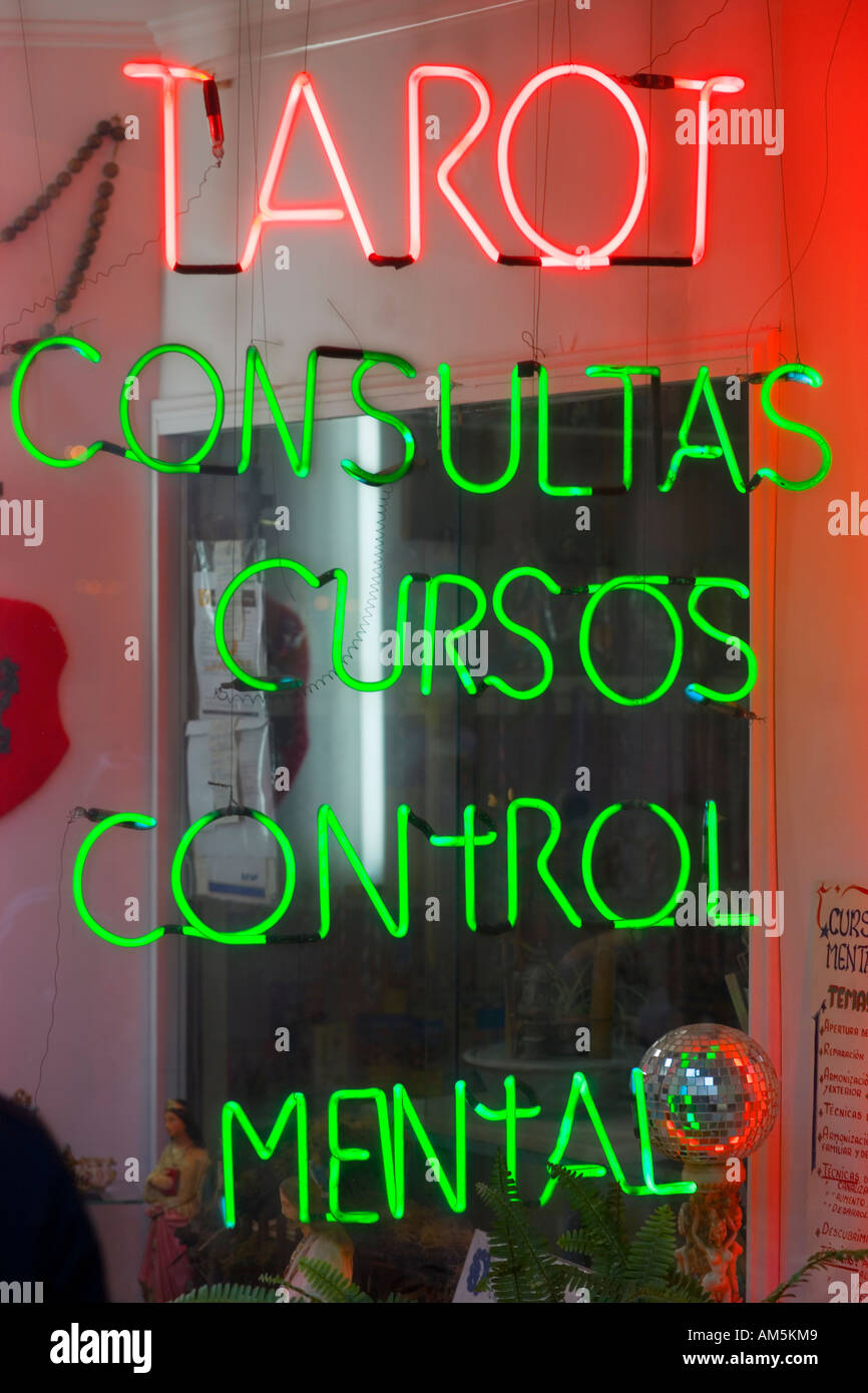 Spanish neon sign reading: tarot mental control consult in shop window ...