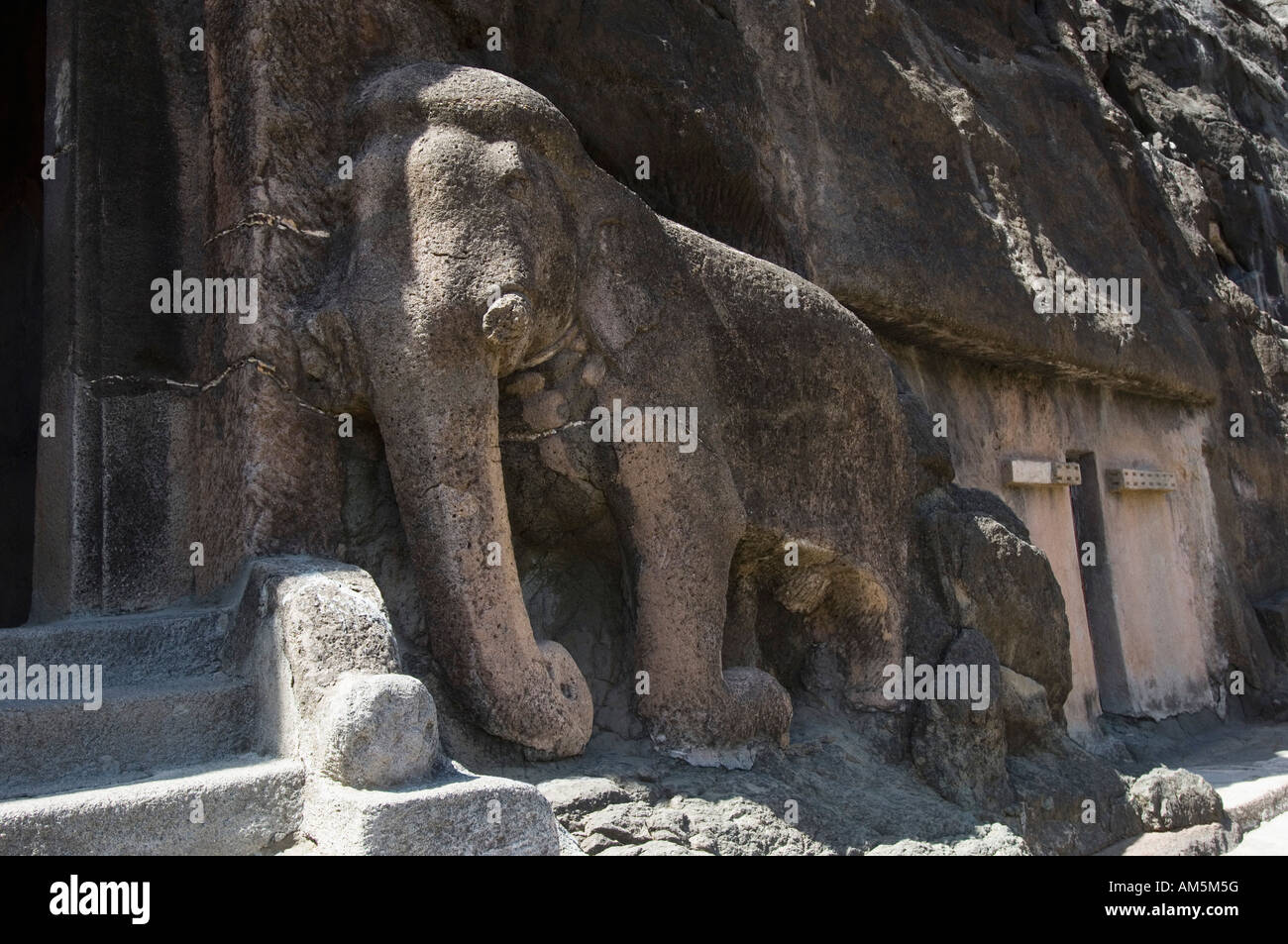 Elephant carved in front of a cave, Ajanta, Maharashtra, India Stock ...