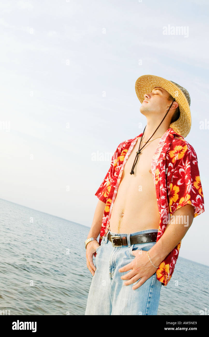Young Man Looking Into Sun On The Water Stock Photo - Alamy