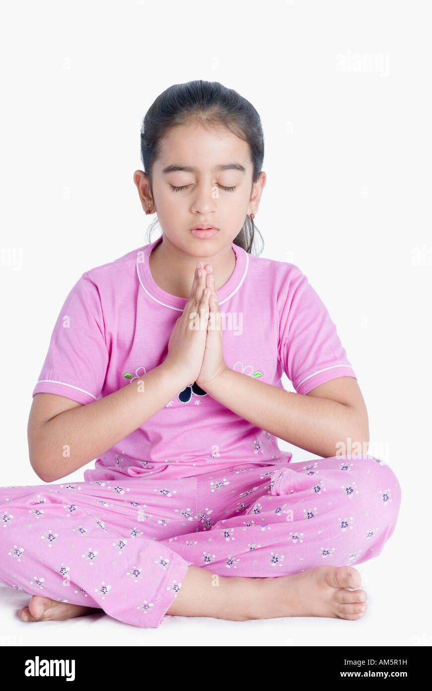 Close-up of a girl in a prayer position Stock Photo - Alamy