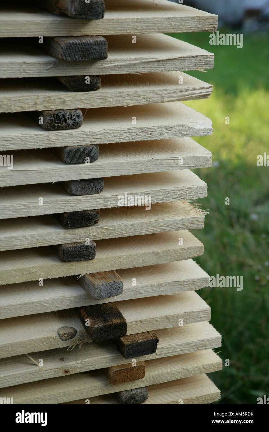 Stacked planks on a lumberyard Stock Photo - Alamy