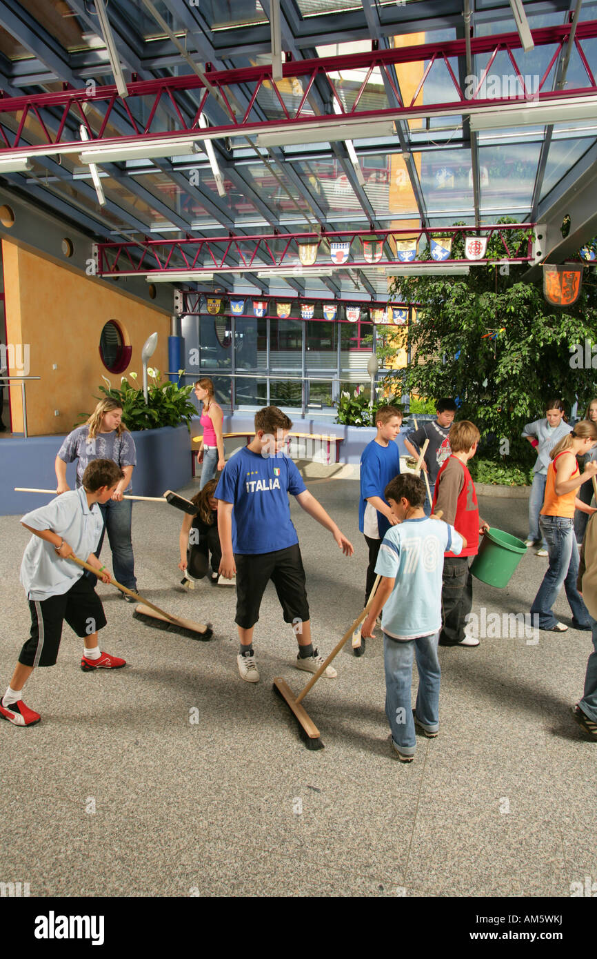 Personal responsibility, schoolchildren cleaning break hall of new ...
