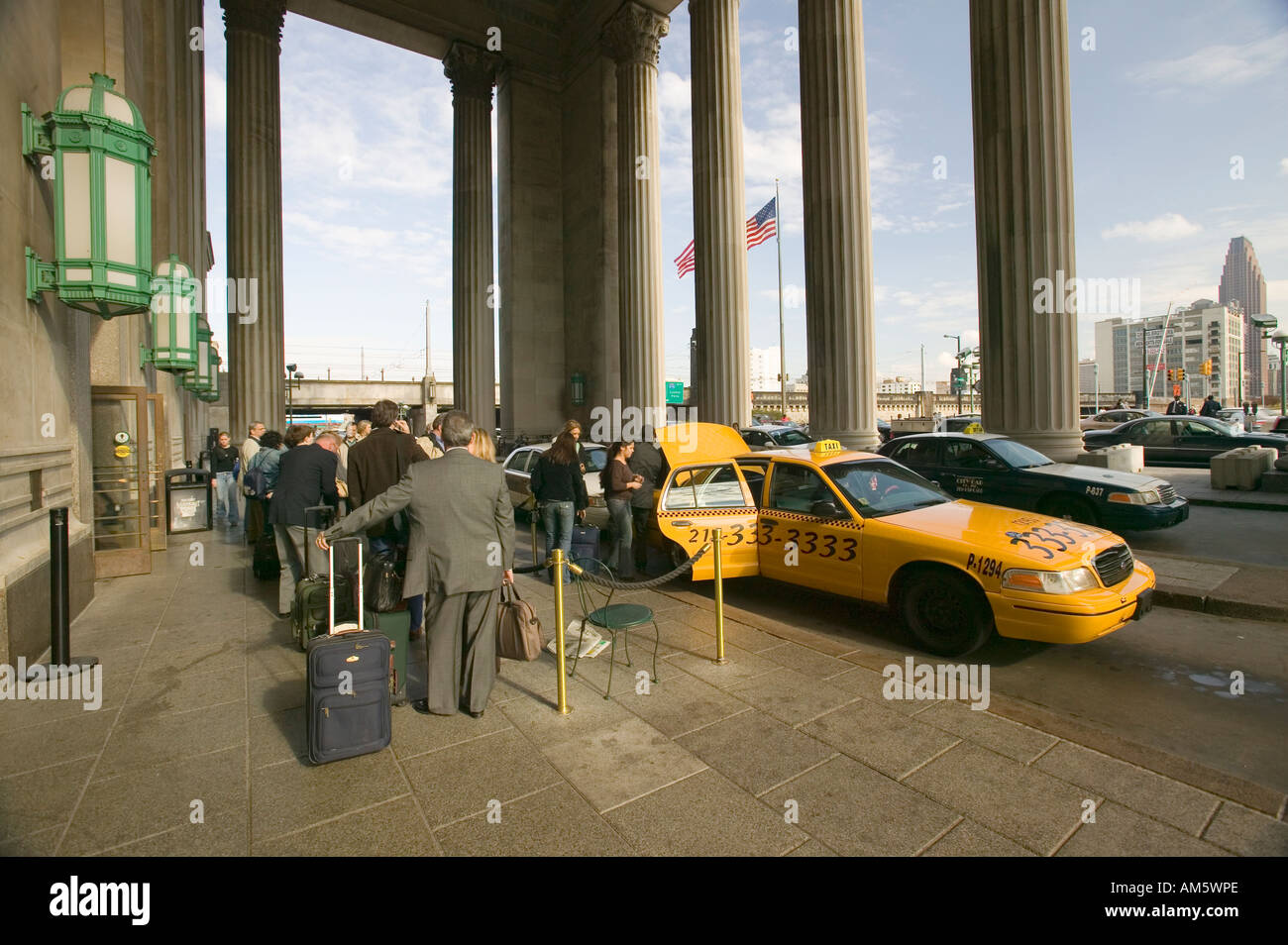 Exterior view of yellow taxi cab in front of the 30th Street Station a ...