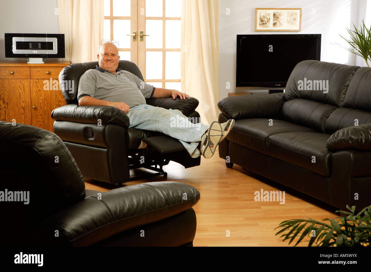 Single man 50 55 60 Fifties 50 s relaxing at home Stock Photo - Alamy