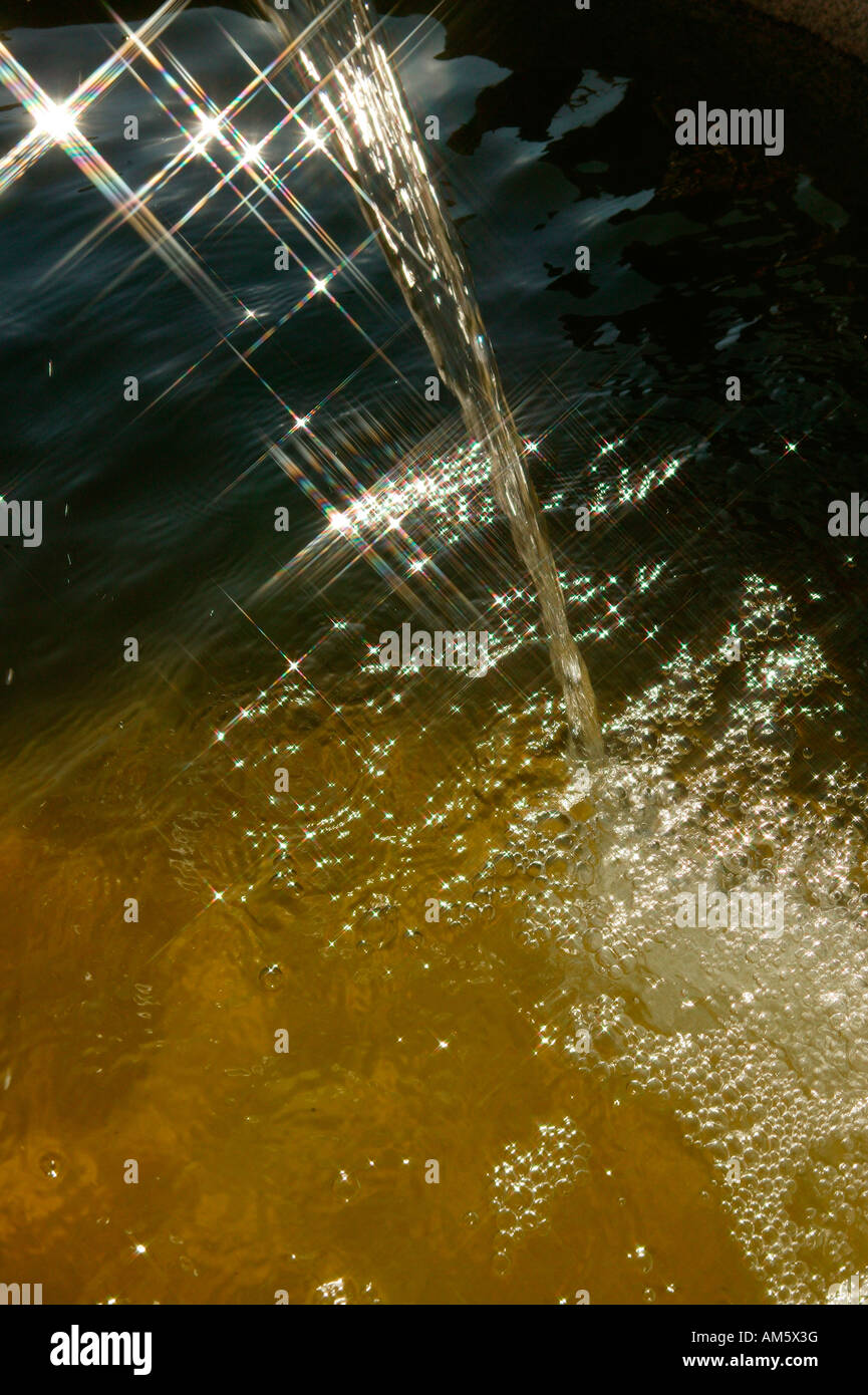 Jet of water plashing in a fountain Stock Photo - Alamy
