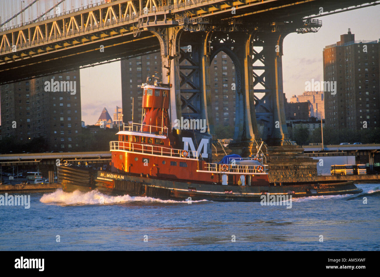 Tug boat under Brooklyn Bridge New York NY Stock Photo - Alamy
