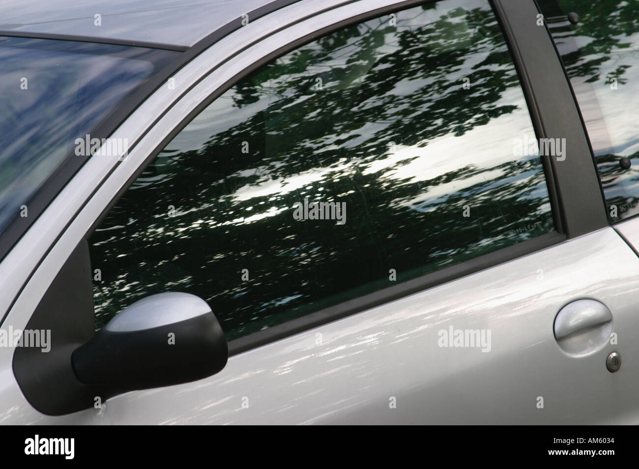 Reflections in car window Stock Photo - Alamy