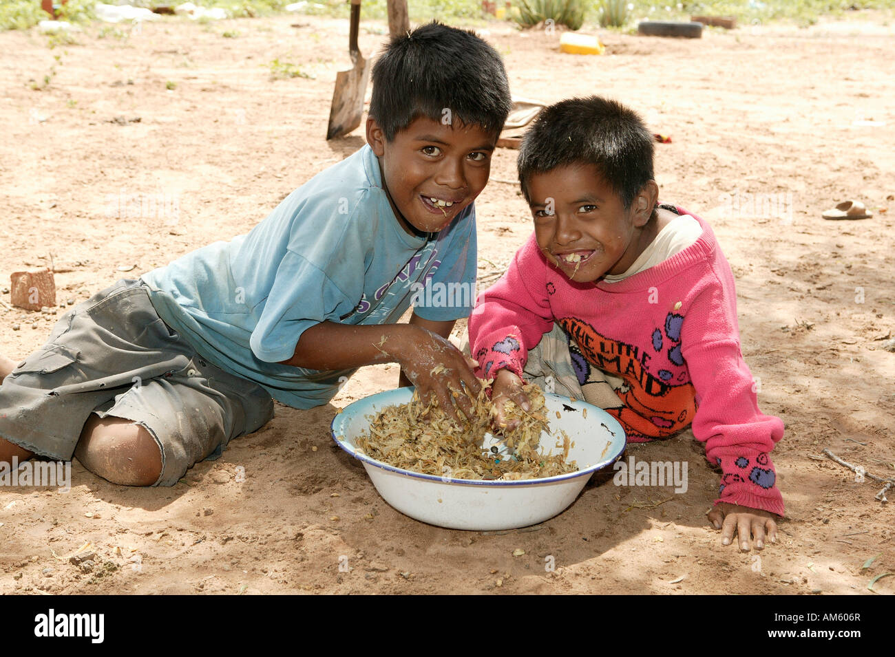 Children eating fresh, hackled sugar cane, Nivaclé native American ...