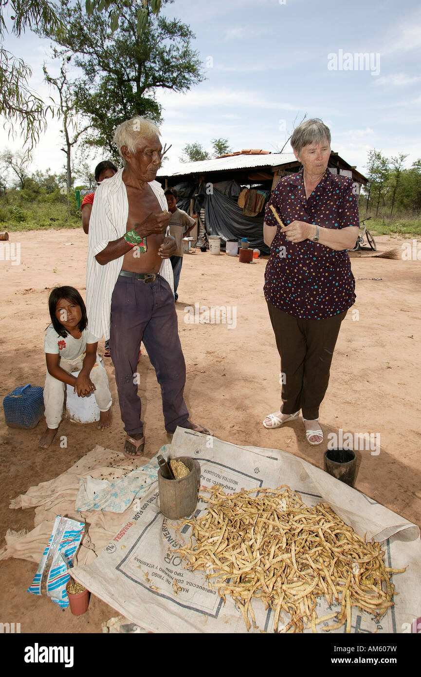 Female doctor with Nivaclé native Americans, beans for using lying on a ...