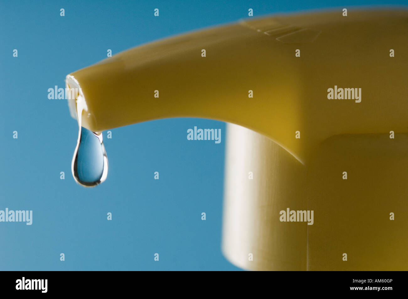 Close-up of a water drop falling from a soap dispenser Stock Photo - Alamy