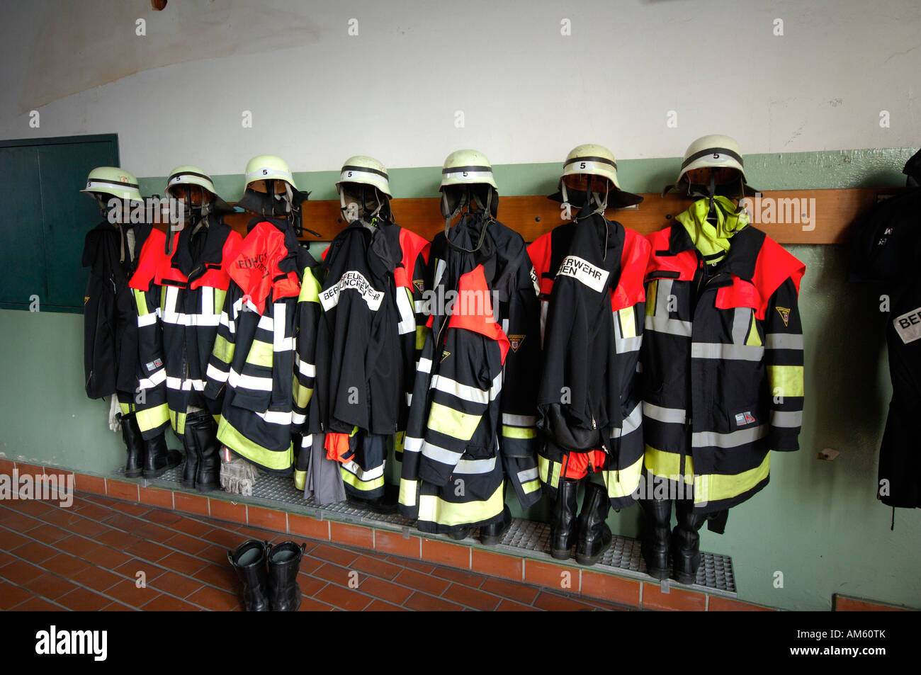 Jackets and helmets from the firefighters Stock Photo - Alamy