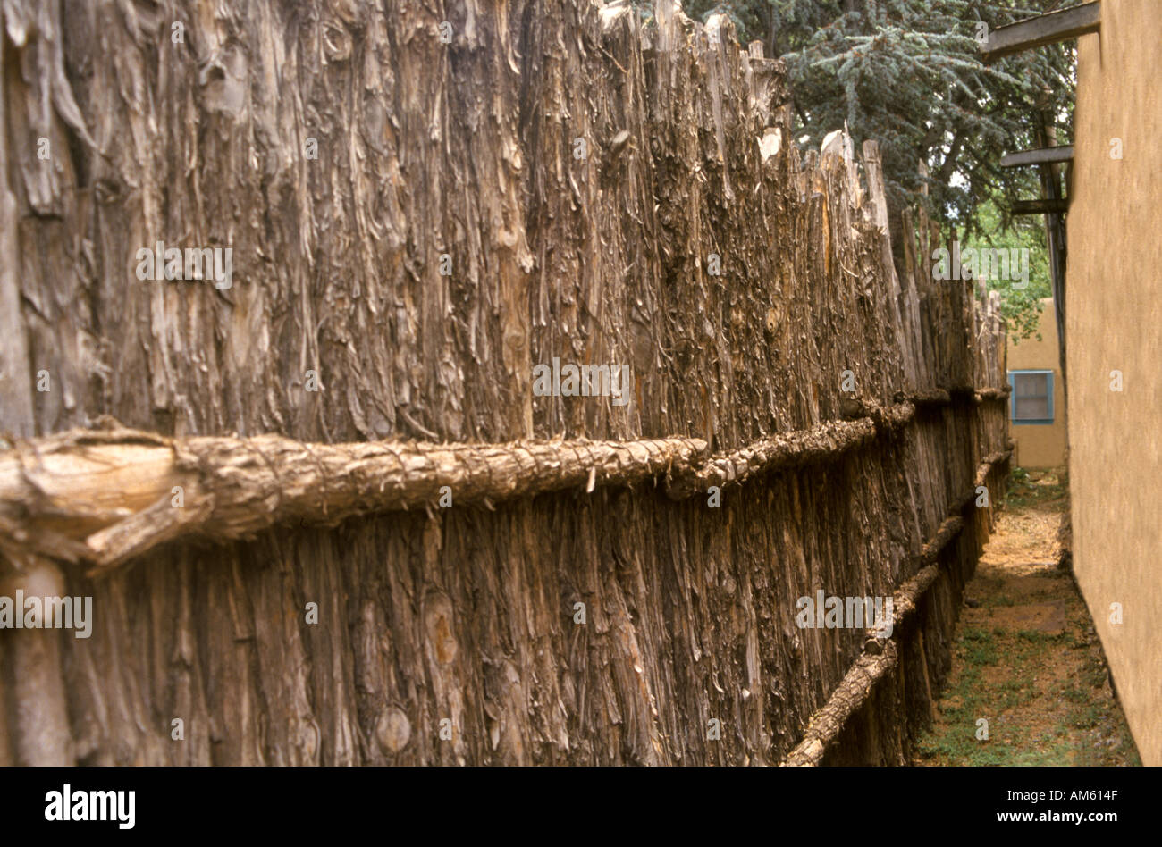 adobe house with tree limb fence New Mexico US America Stock Photo - Alamy
